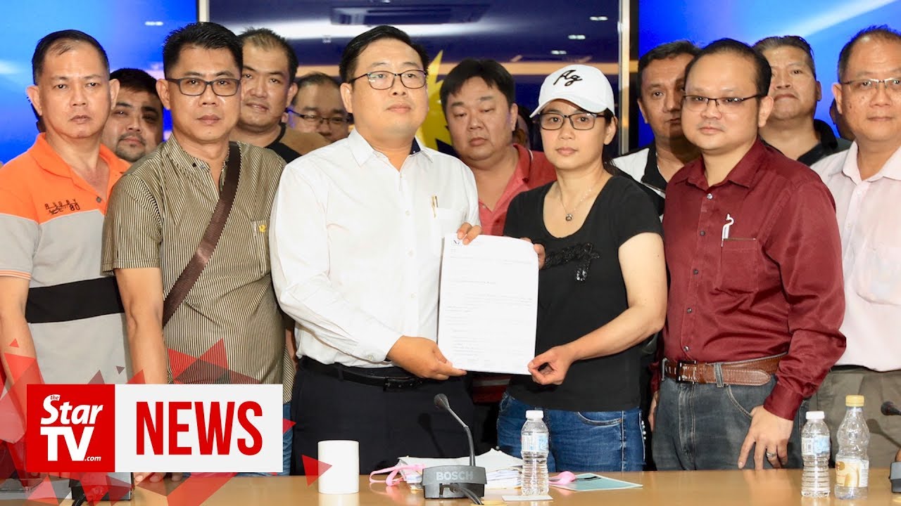 E-hailing drivers sue Grab, Transport Ministry over workers' rights ...